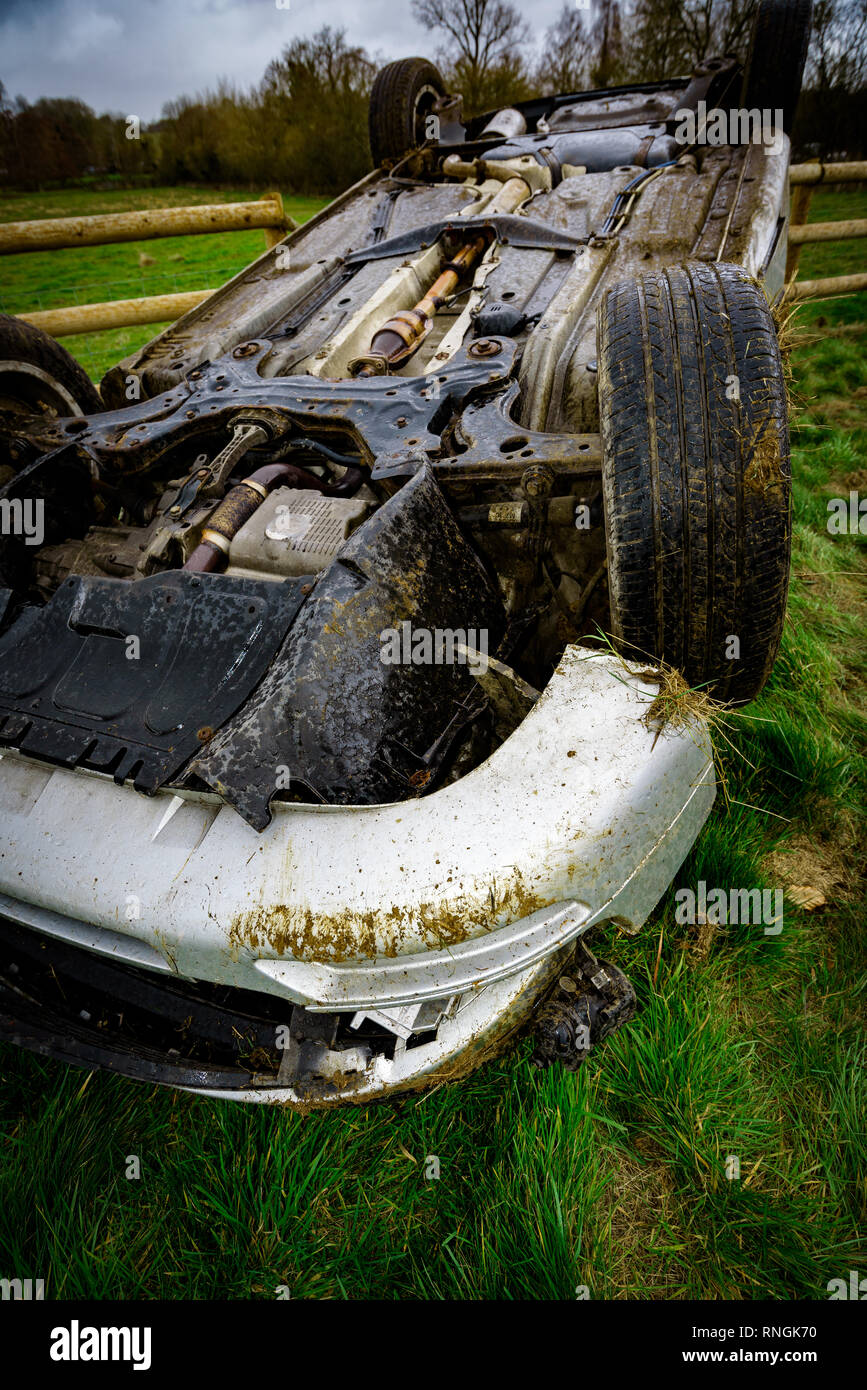 Car Crash and Car Damage. Vehicle rolled over in a field after a high ...