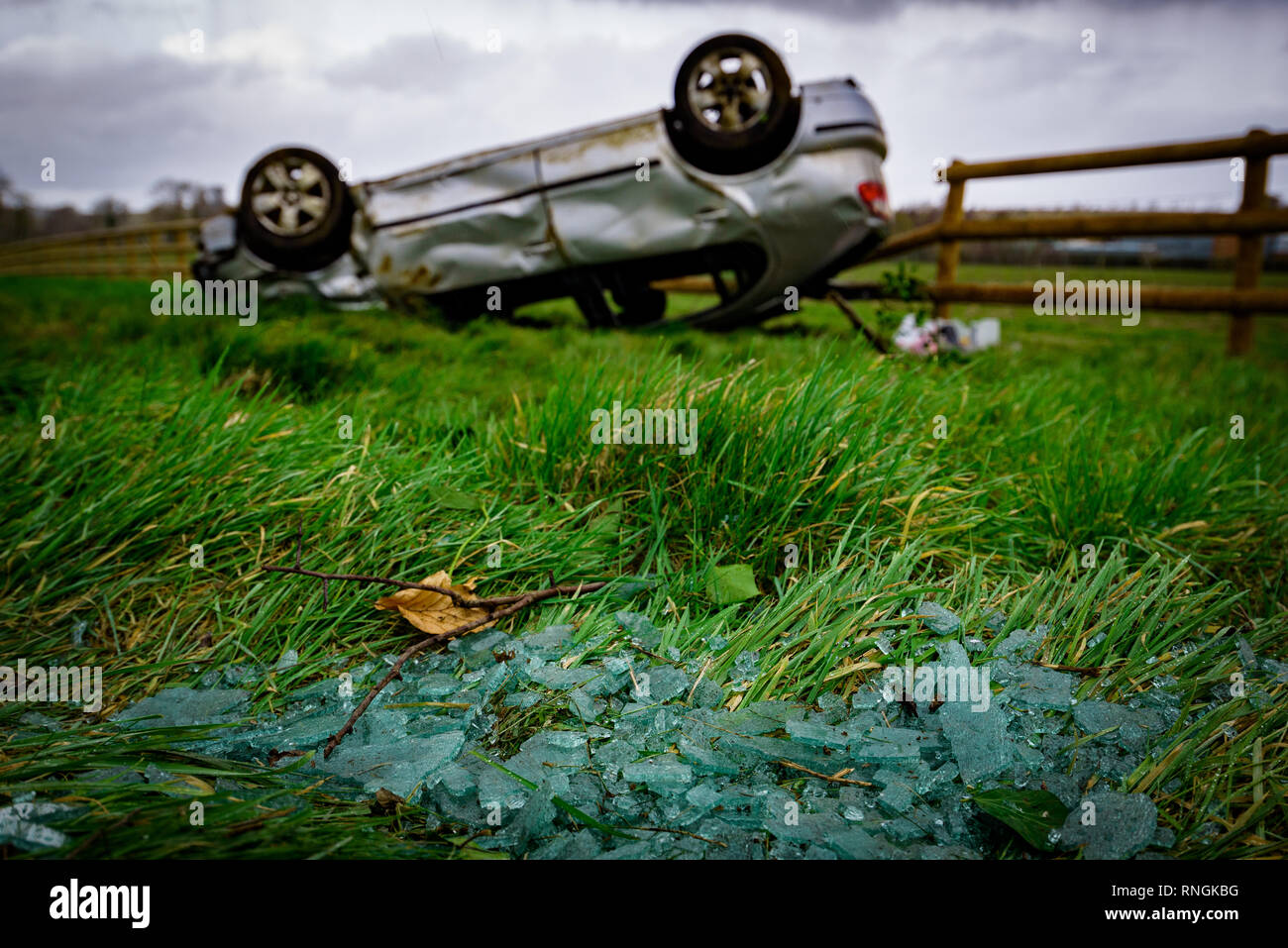 Car Crash and Car Damage. Vehicle upside down in a field surrounded by ...
