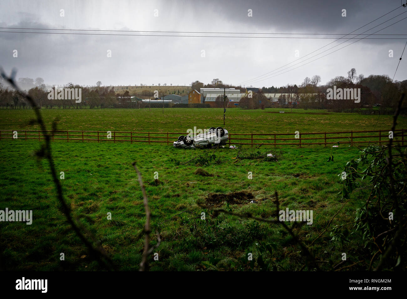 Car Crash and Car Damage; Vehicle upside down in a field after high ...