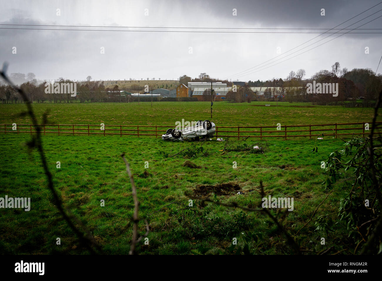 Car Crash and Car Damage; Vehicle upside down in a field after high ...