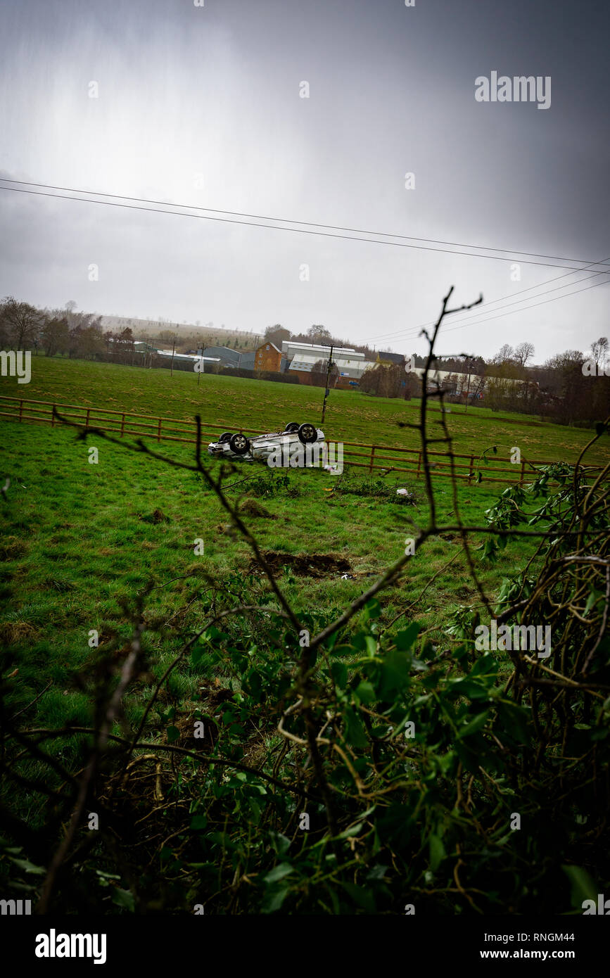 Car Crash and Car Damage; Vehicle upside down in a field after high ...