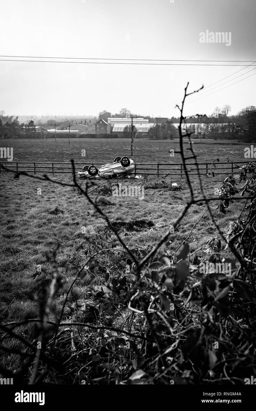 Car Crash and Car Damage; Vehicle upside down in a field after high ...