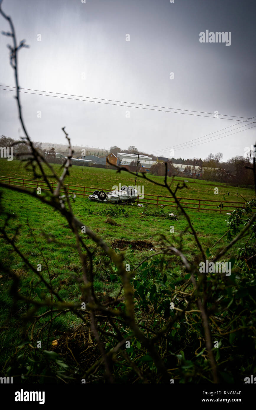Car Crash and Car Damage; Vehicle upside down in a field after high ...