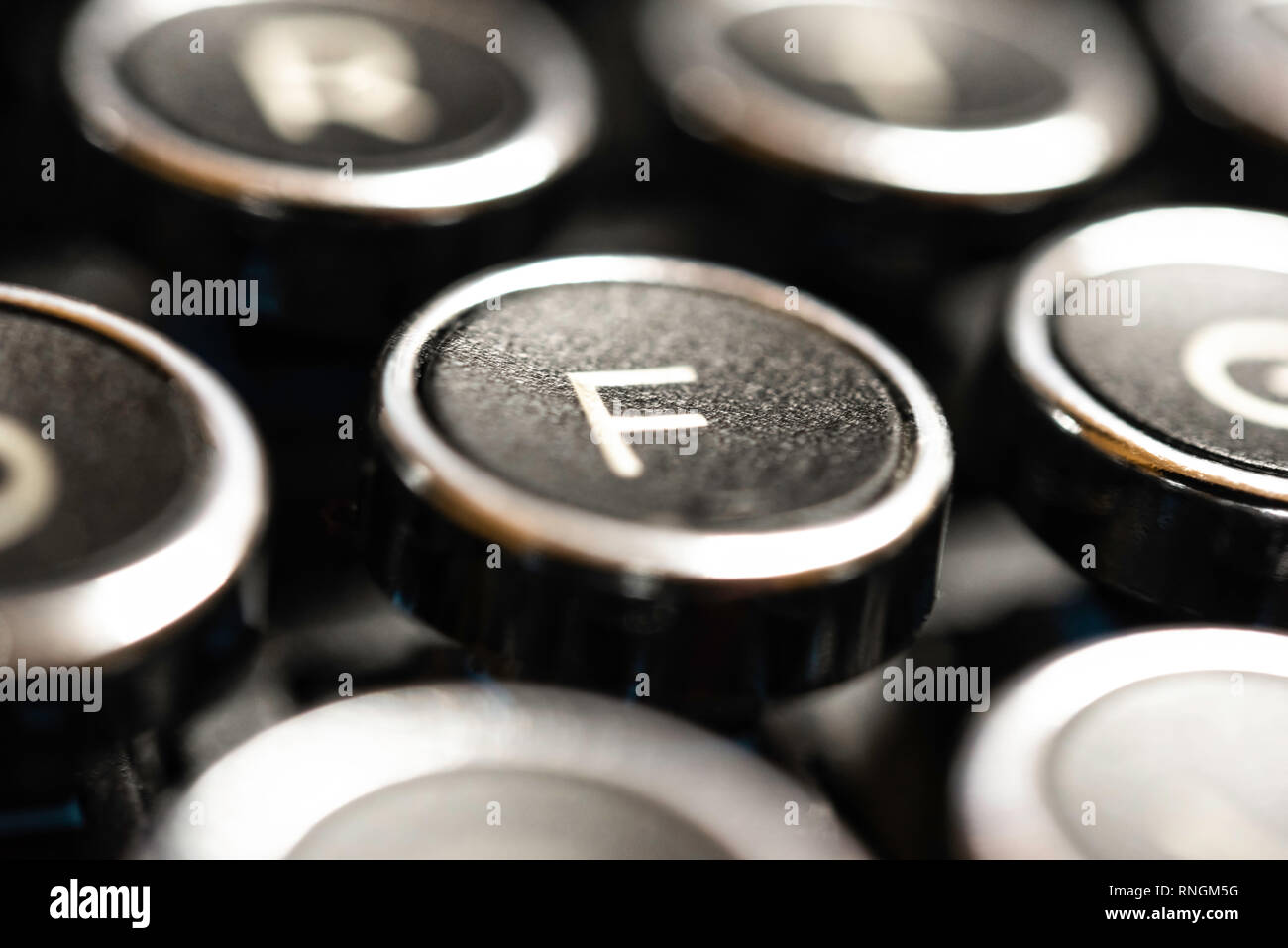An extreme close-up or a macro shot of black circular metal keyboard ...