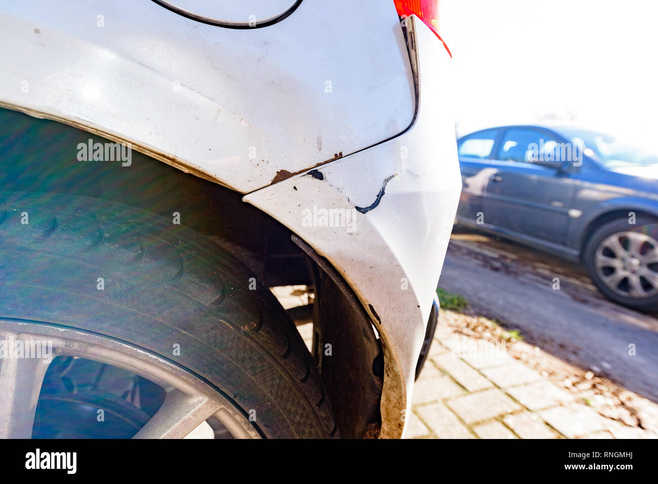 Car Crash and Car Damage; White vehicle rear bumper damage Stock Photo ...