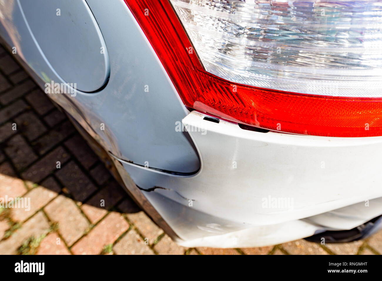 Car Crash and Car Damage; White vehicle rear bumper damage Stock Photo ...
