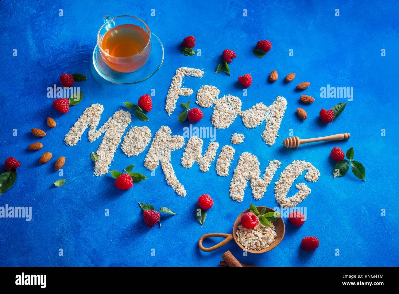 Good Morning words written with oatmeal, raspberries and cinnamon ...