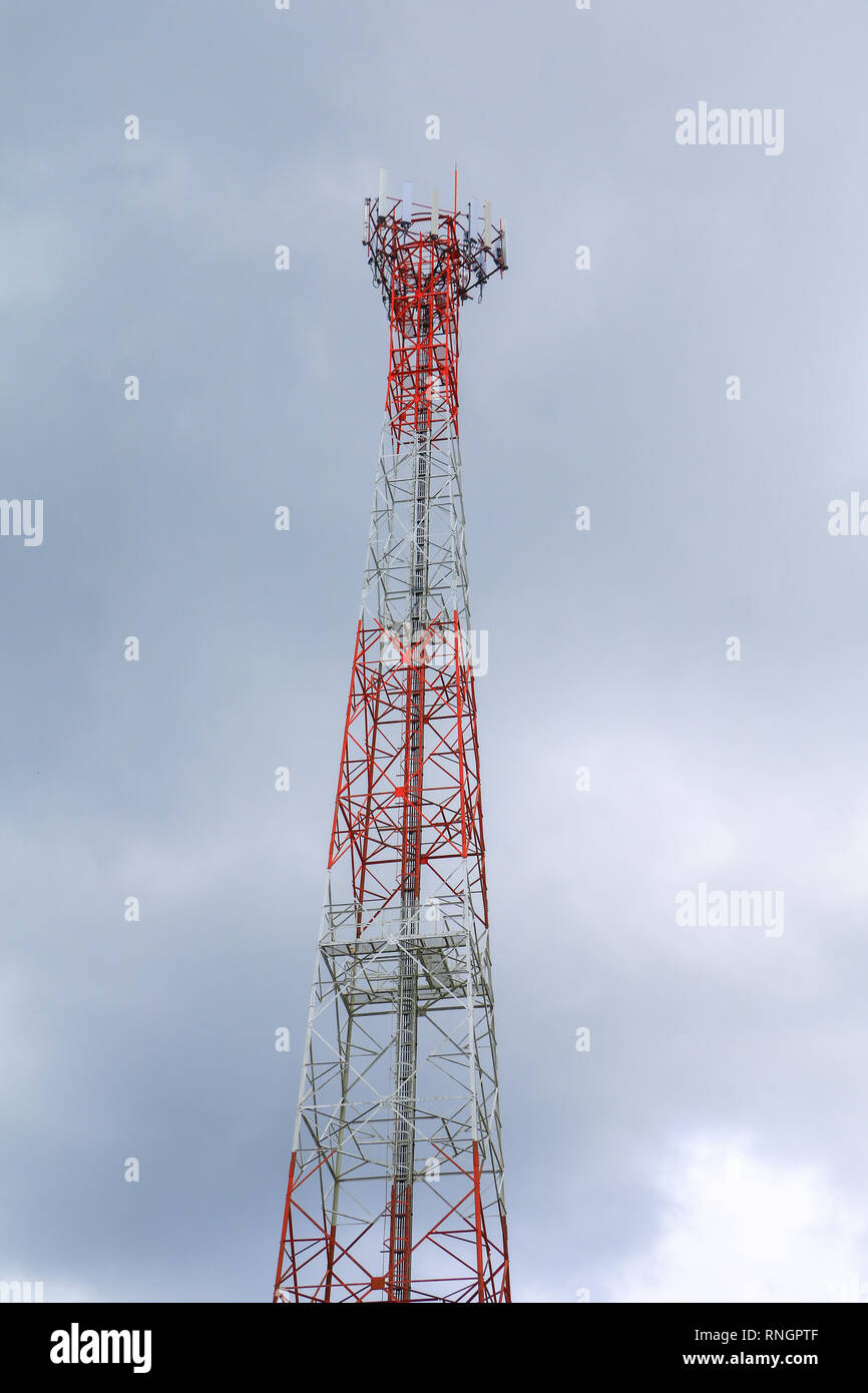 Telecommunication tower red and white antenna radio telephone mobile on sky background Stock ...