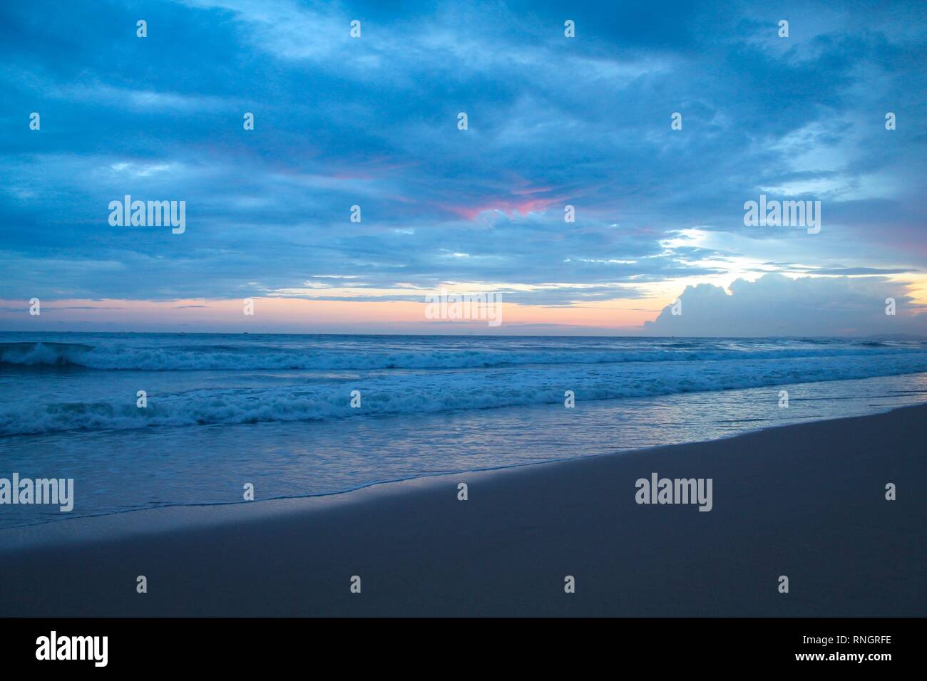 Sun set at beach Stock Photo - Alamy