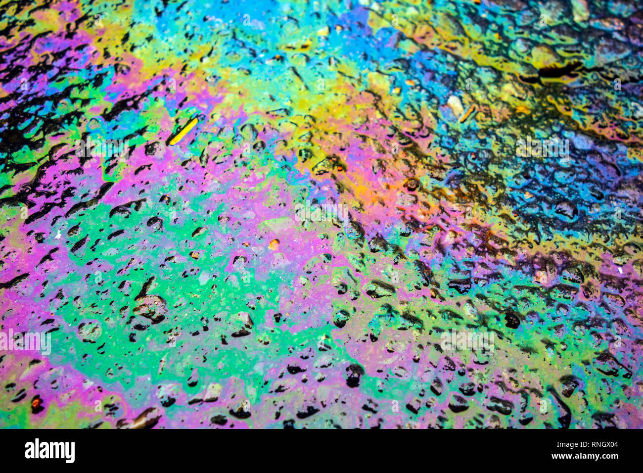 Gasoline Petrol Oil Spill Rainbow on Tarmac Road Stock Photo - Alamy