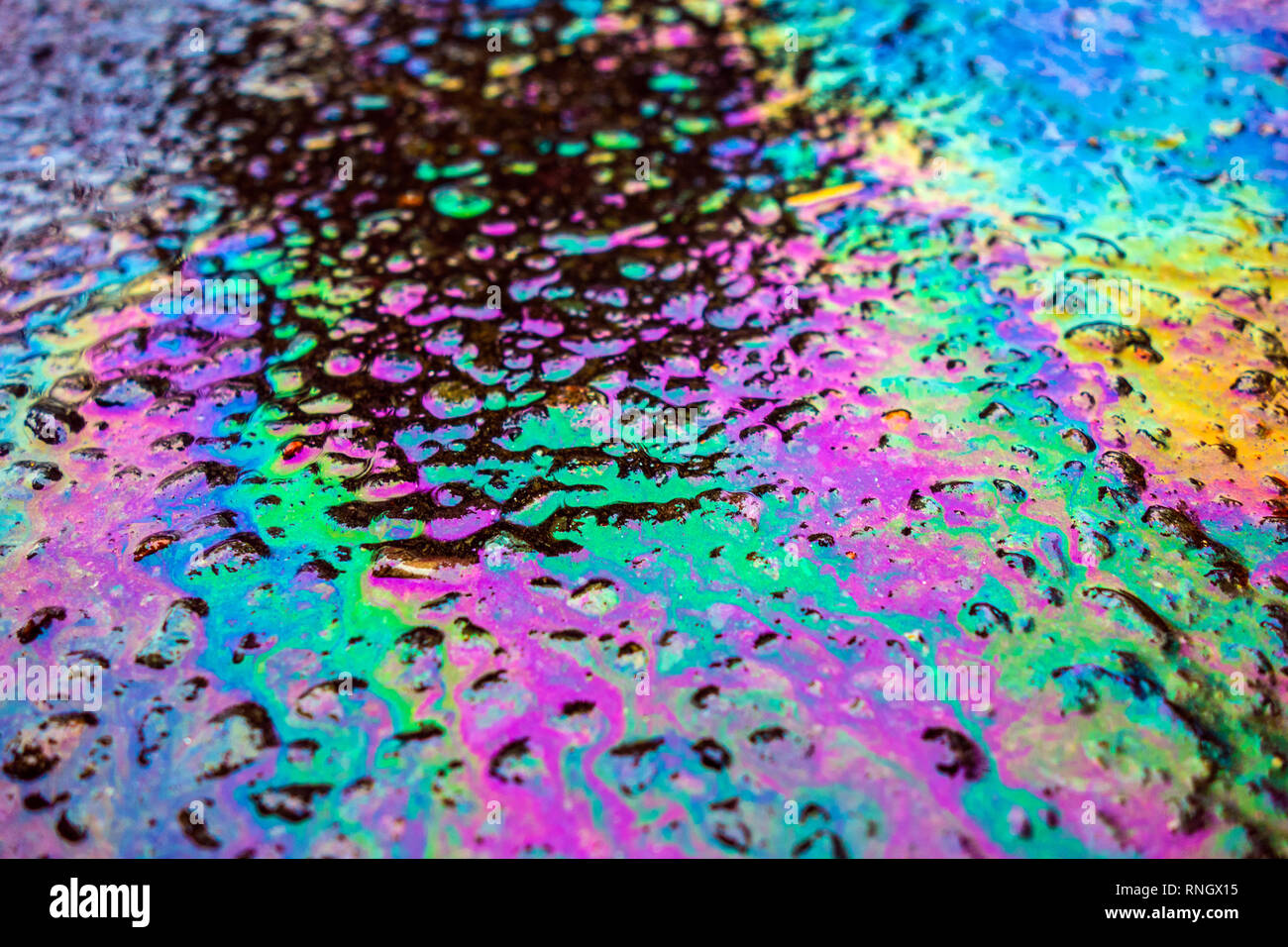 Gasoline Petrol Oil Spill Rainbow on Tarmac Road Stock Photo - Alamy