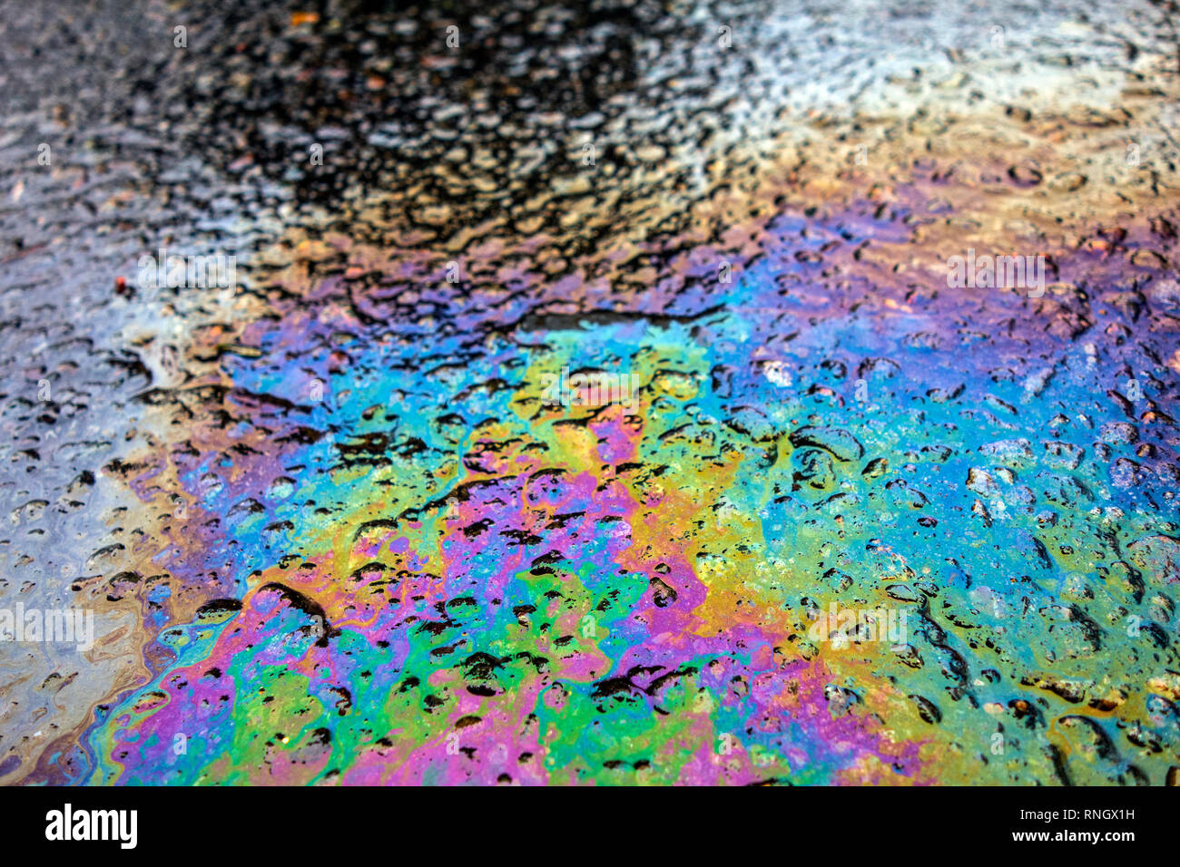 Gasoline Petrol Oil Spill Rainbow on Tarmac Road Stock Photo - Alamy