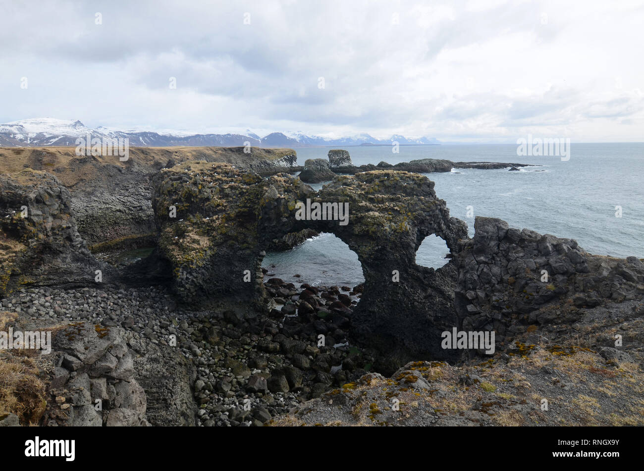 Coastal arch rock formation made of lava rock on the coast Stock Photo ...