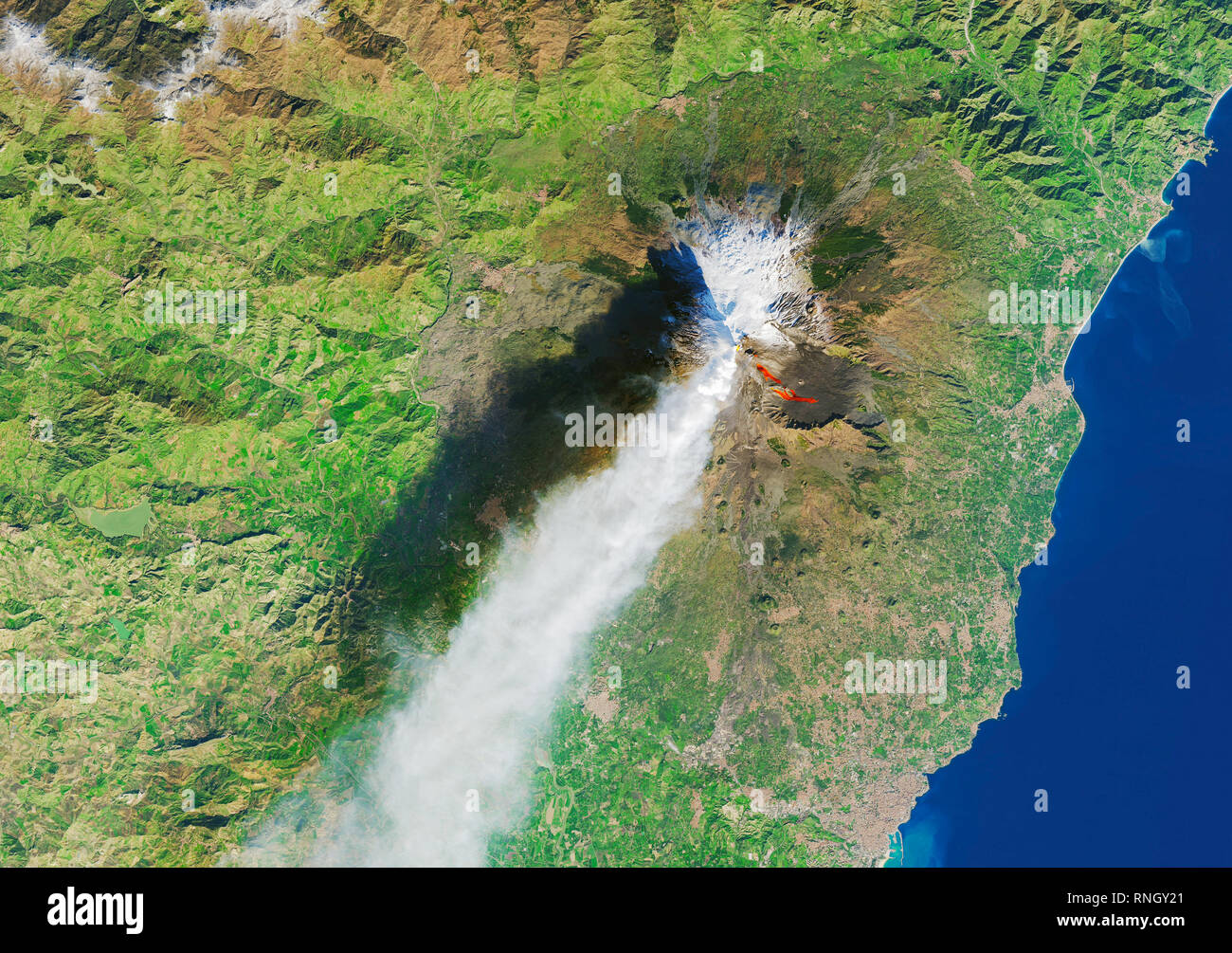 Aerial view of Mount Etna Volcano with steam rising and lava flows ...