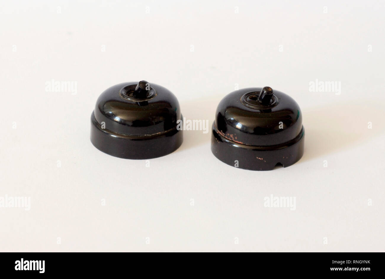 Two black bakelite vintage switches Stock Photo - Alamy