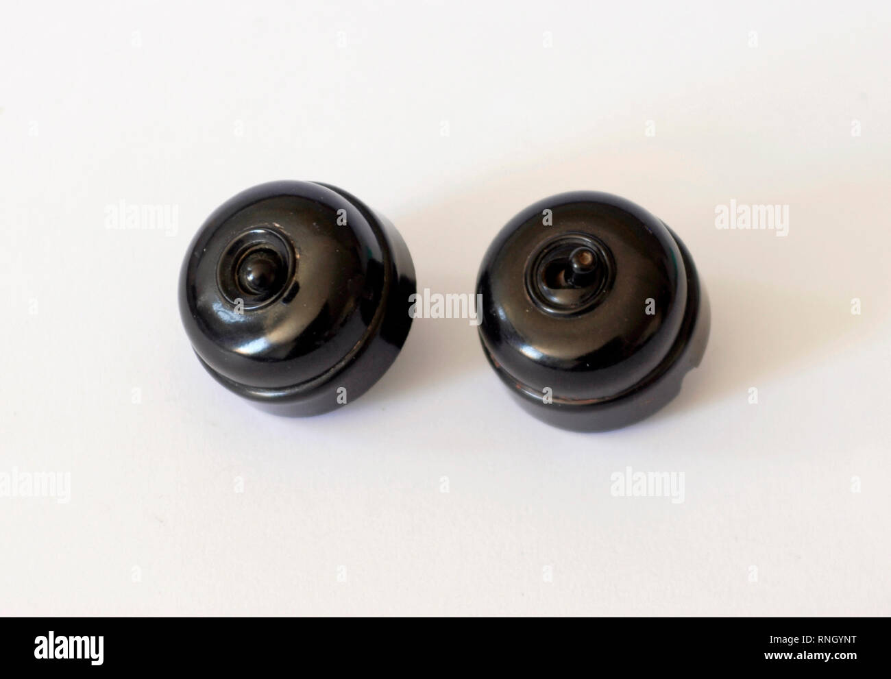 Two black bakelite vintage switches Stock Photo - Alamy