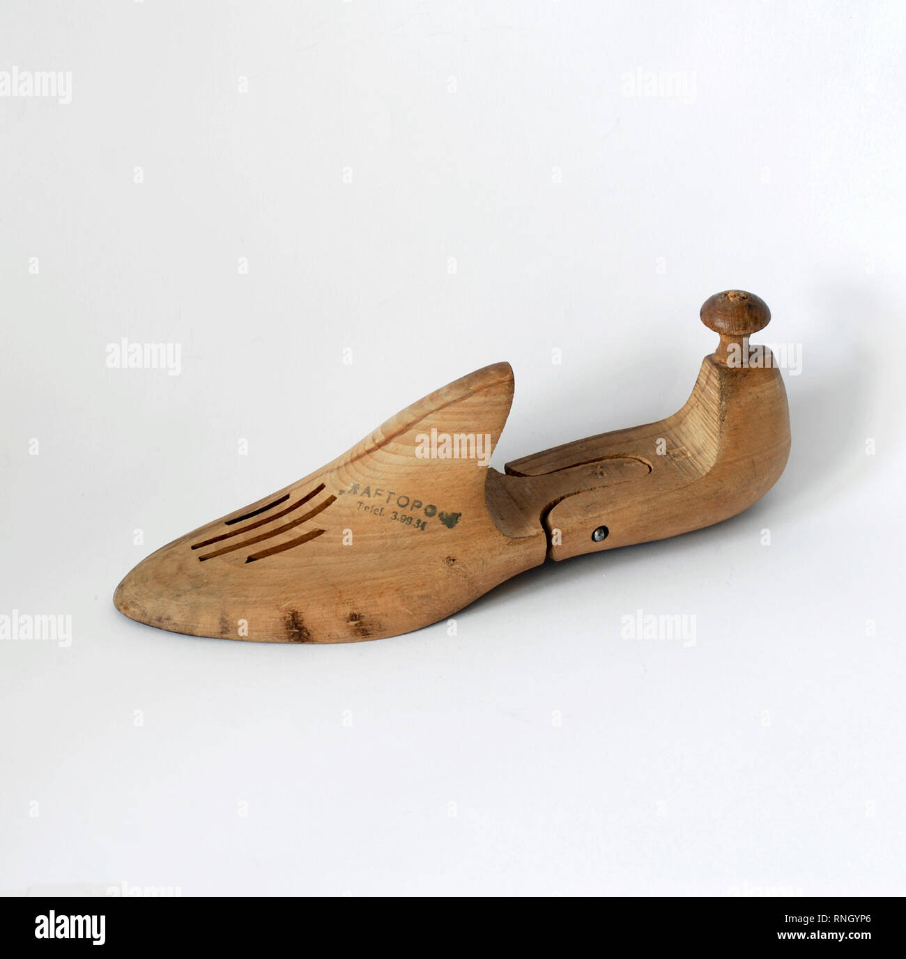 Vintage folding wooden shoe last Stock Photo - Alamy
