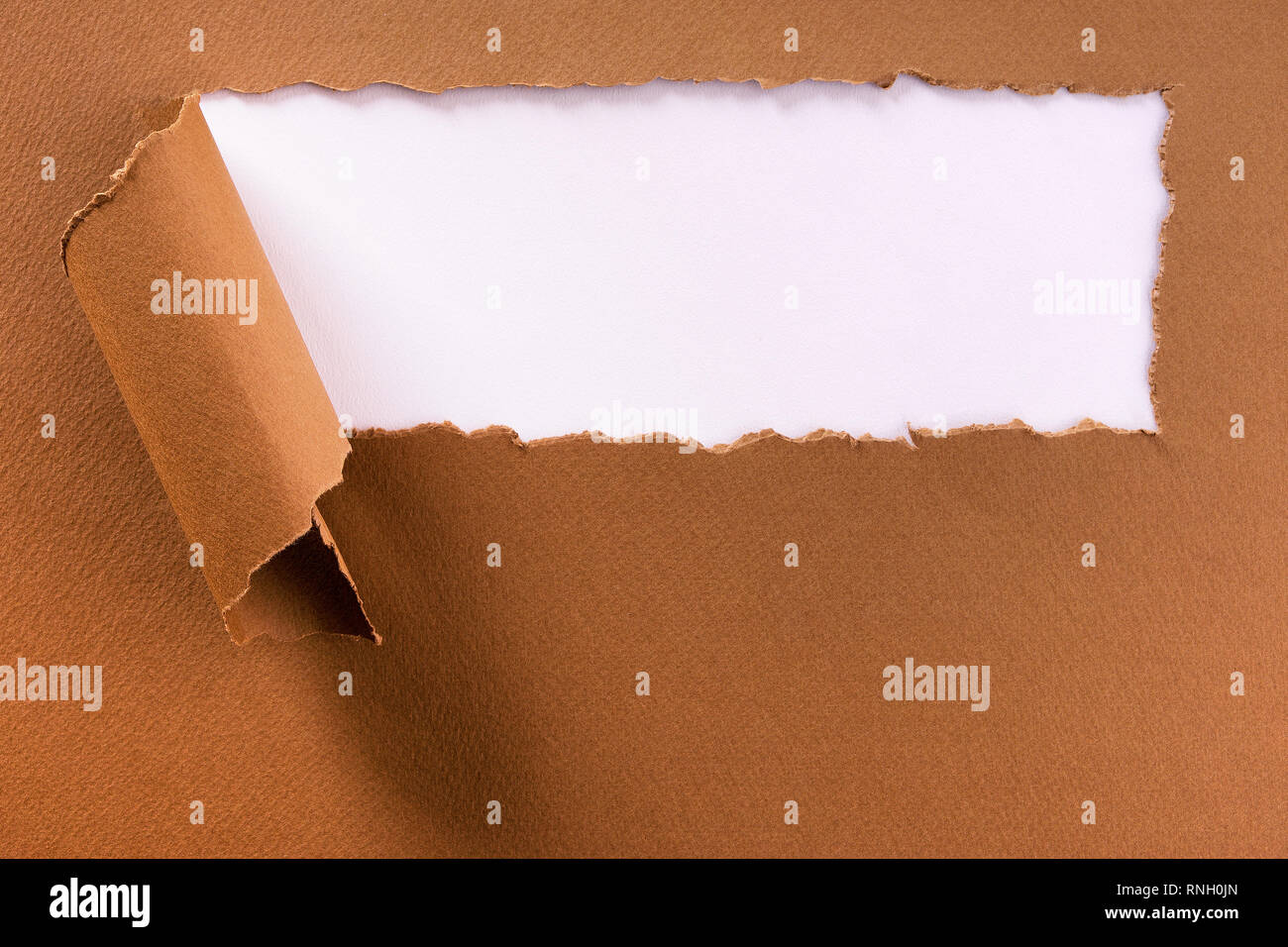 Torn brown paper strip header background frame Stock Photo - Alamy