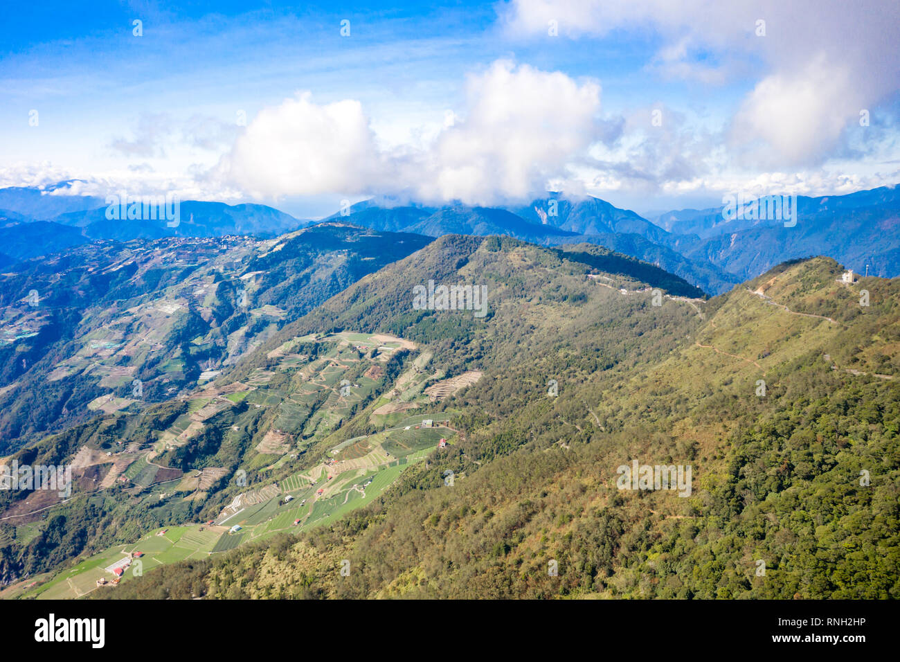 Aerial flying towards spectacular mountain hi-res stock photography and ...