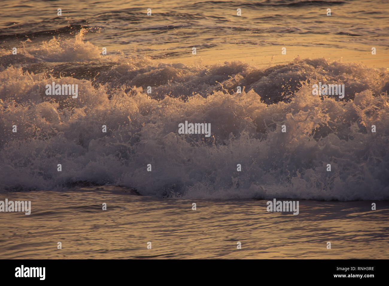 Sunlight Reflected On Water Waves In The Beach Stock Photo - Alamy