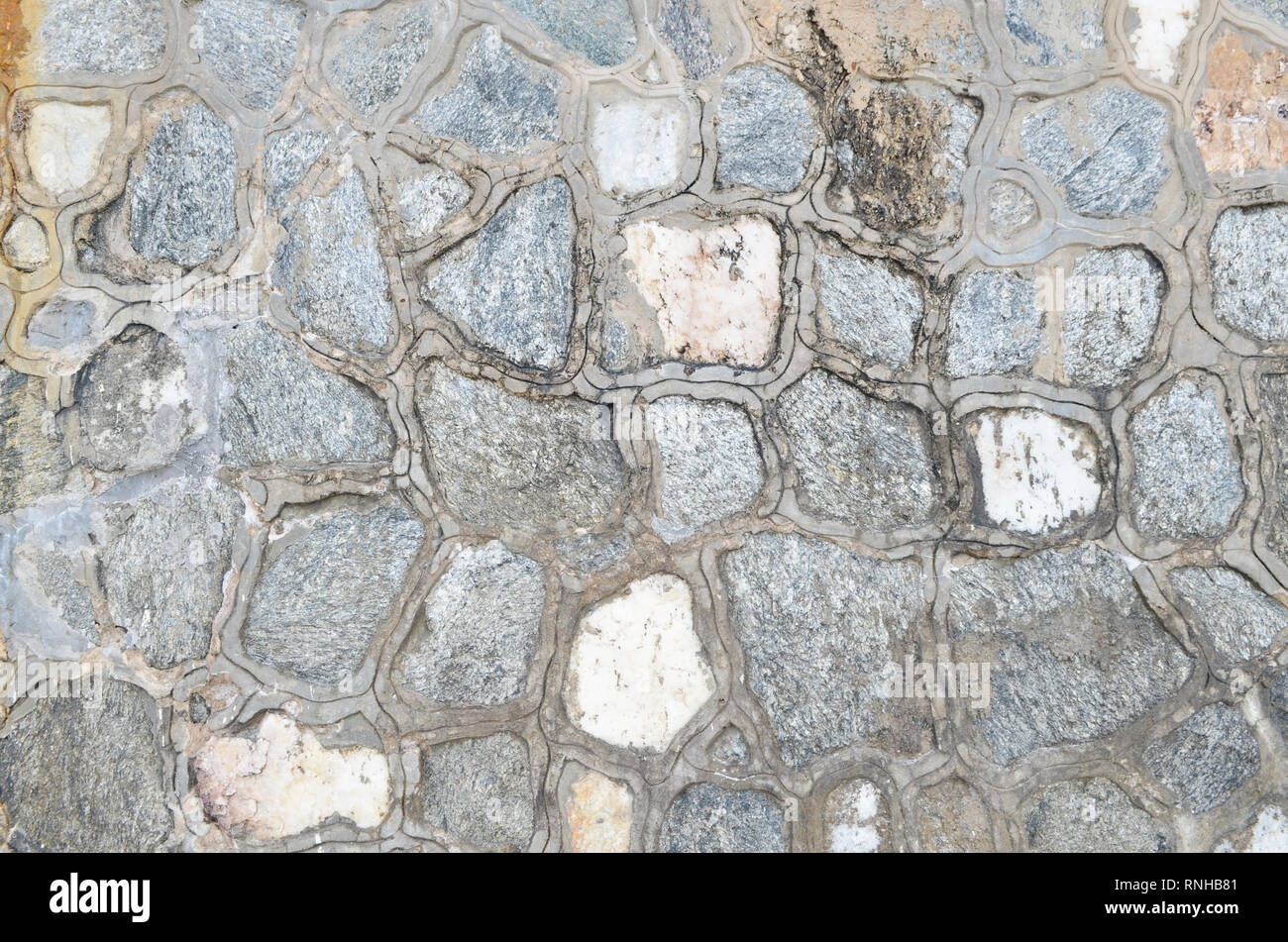 Weathered antique old cracked stone blocks wall retro background Stock ...