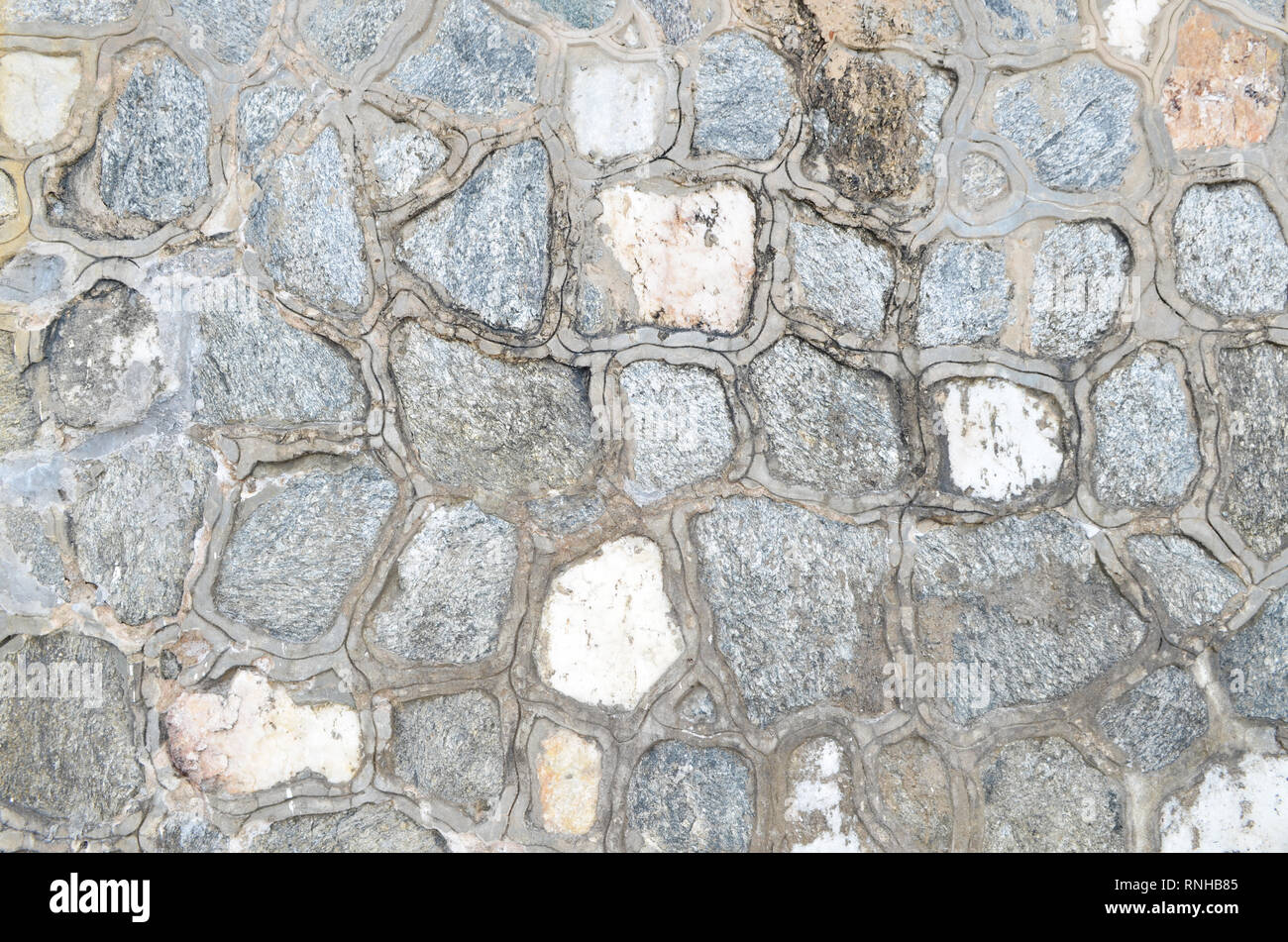 Weathered antique old cracked stone blocks wall retro background Stock ...