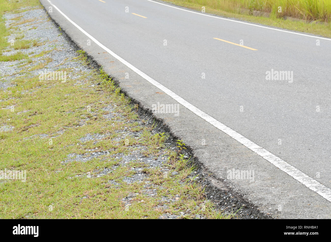 Section of asphalt road in a rural area Stock Photo - Alamy