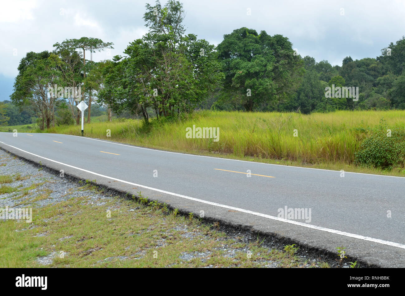 Section of asphalt road in a rural area Stock Photo - Alamy
