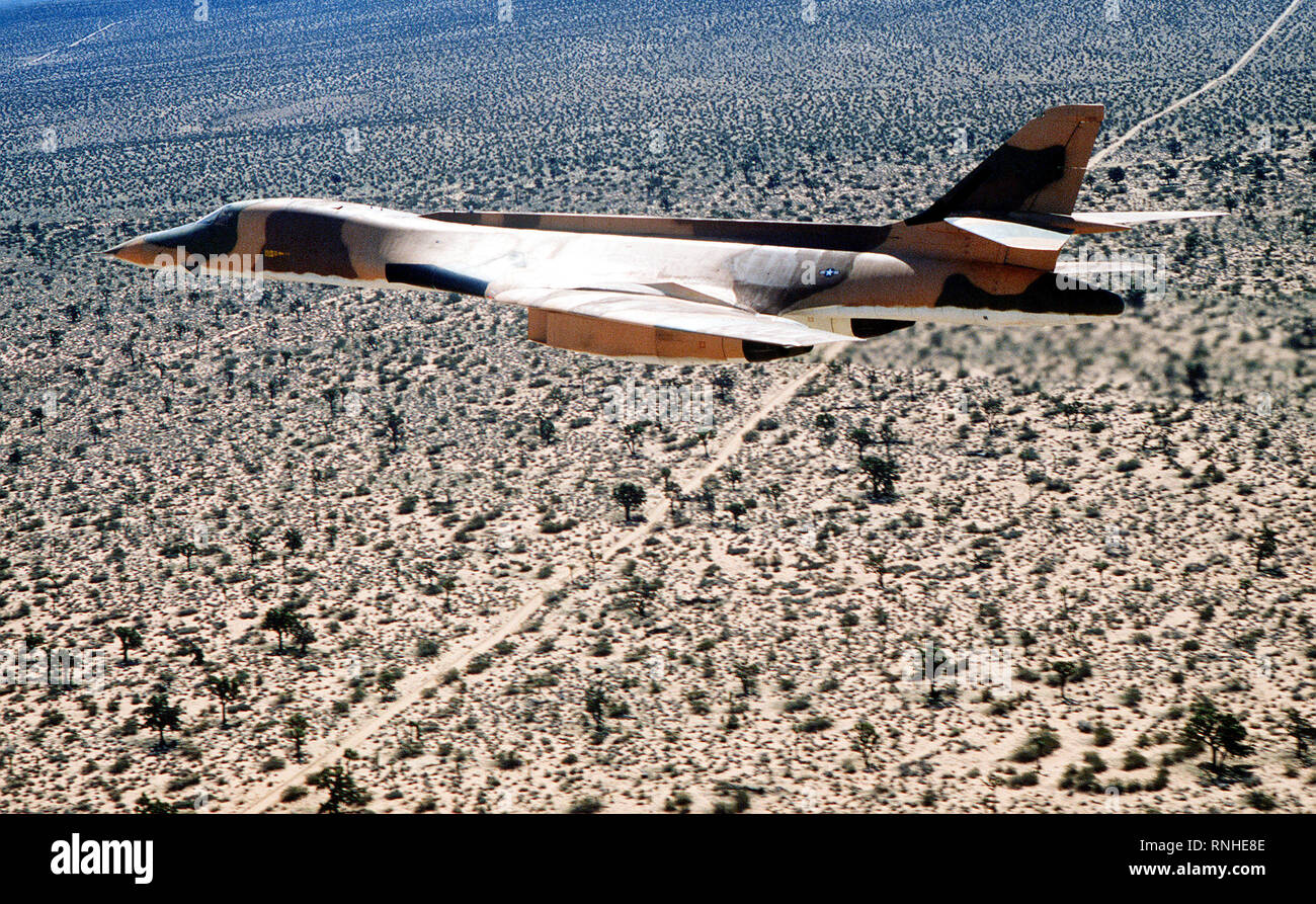 A left side view of a B-1 bomber aircraft over the base range during ...