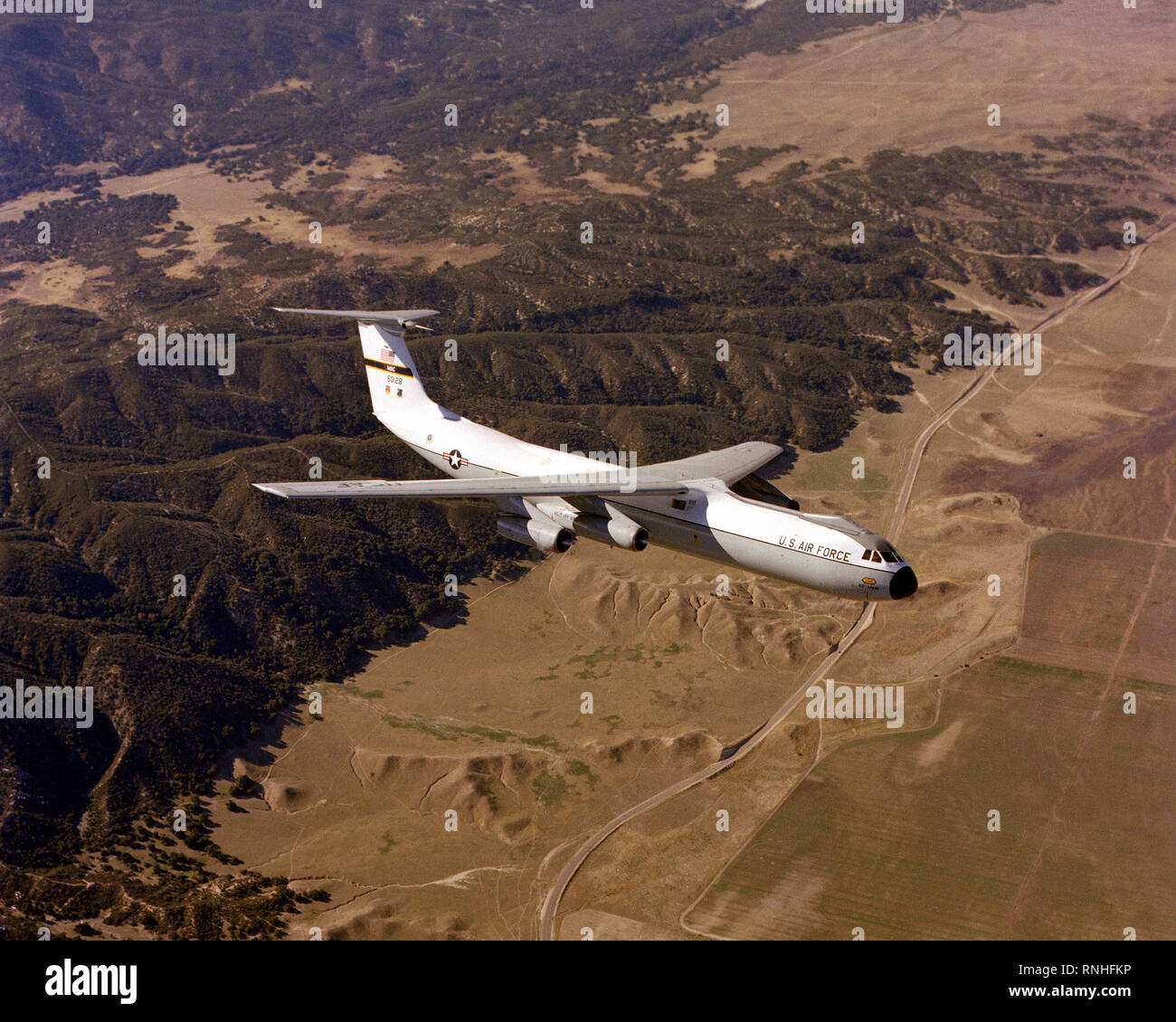 1980 - An air-to-air right side view of a C-141 Starlifter aircraft ...