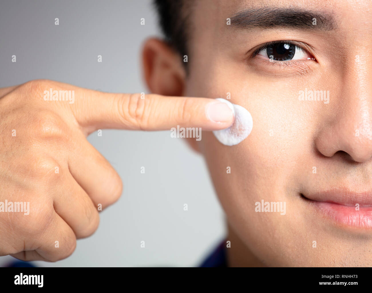 Handsome young man applying face hi-res stock photography and images ...