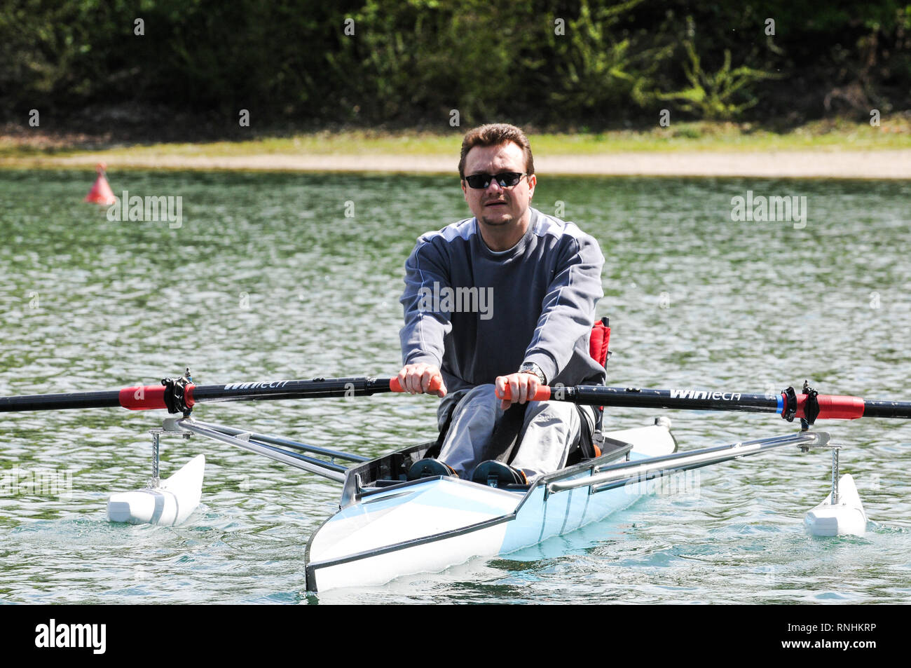 Paraplegic man enjoys rowing at Miribel-Jonage Park, France Stock Photo ...