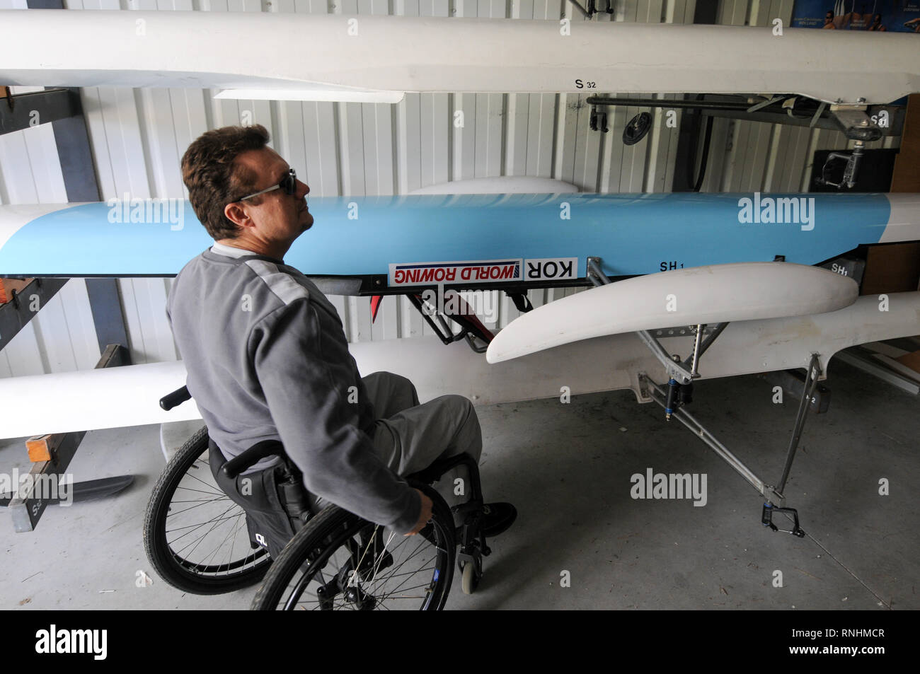 Paraplegic man enjoys rowing at Miribel-Jonage Park, France Stock Photo ...