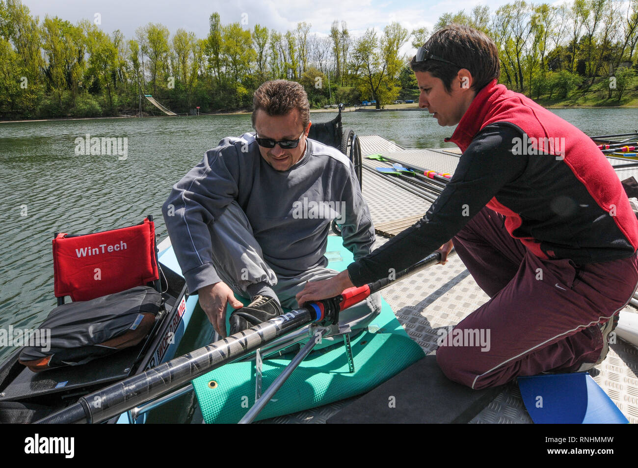 Paraplegic man enjoys rowing at Miribel-Jonage Park, France Stock Photo ...