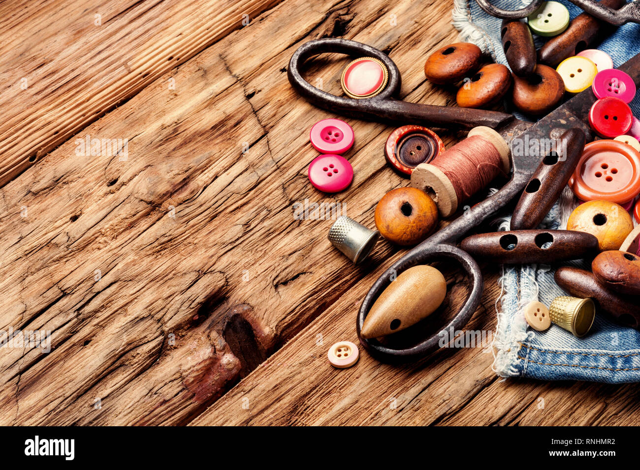 Sewing tools and sewing kit on wooden textured background.Sewing kit ...