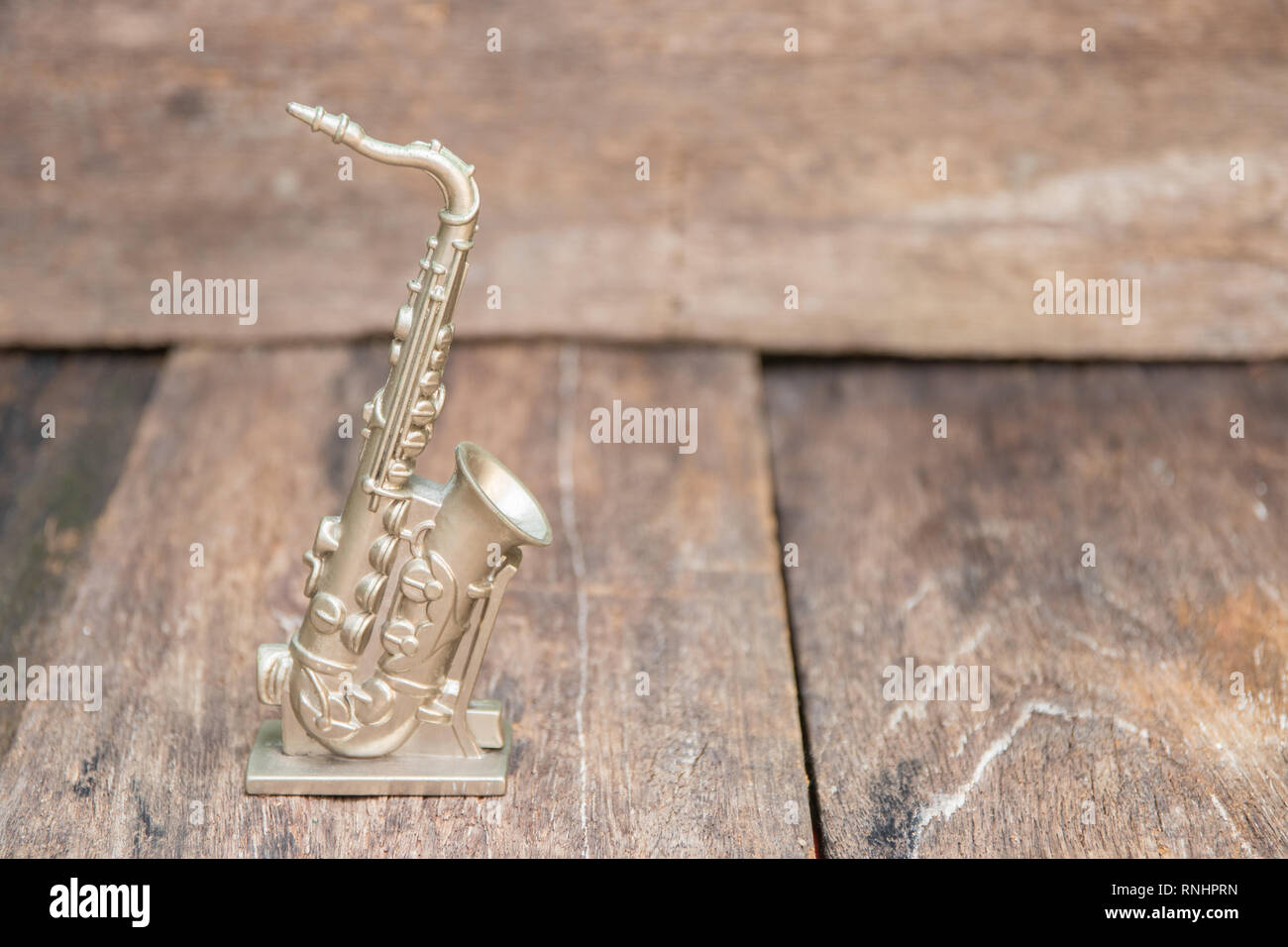 saxophone for decorate old on vintage wooden background with copy space ...