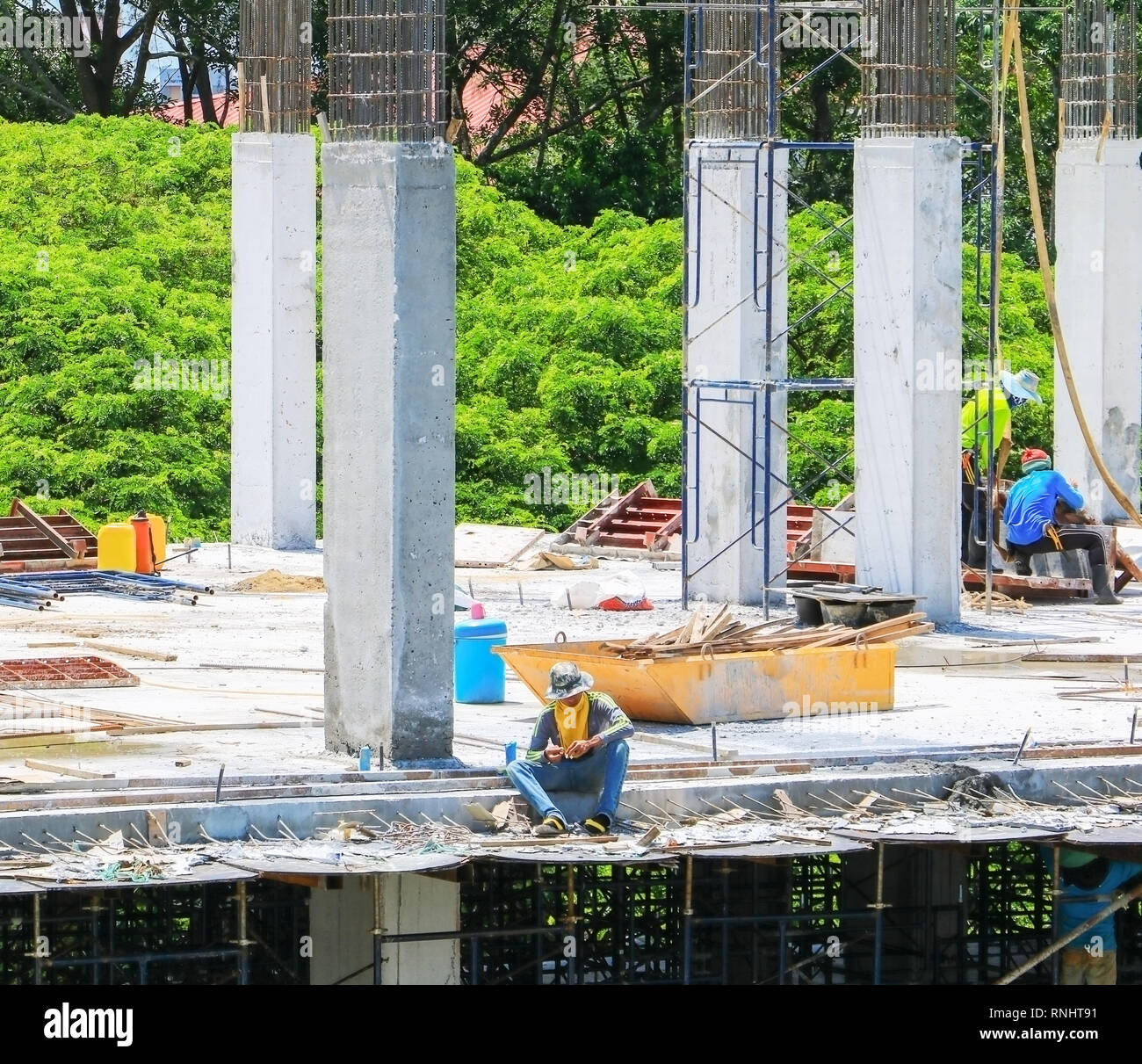 construction laborer team working on high ground building commercial in ...