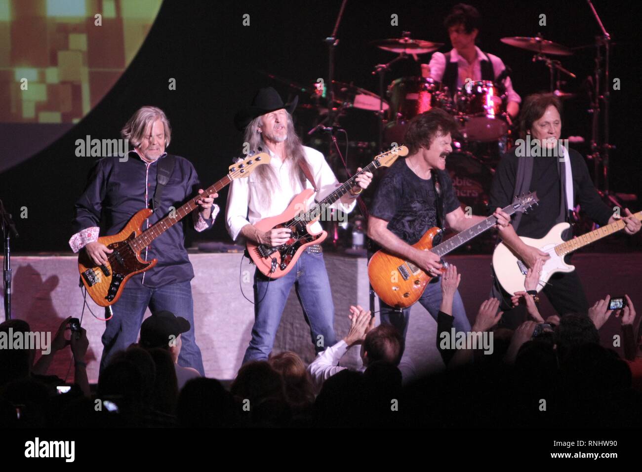 The Doobie Brothers are shown performing on stage during a "live ...