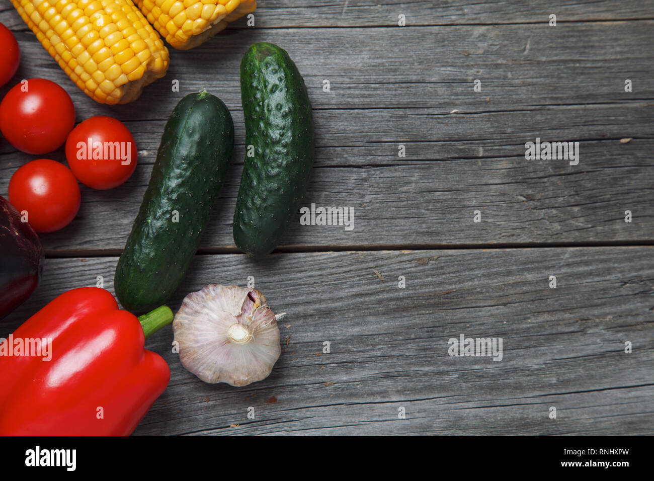 Fresh vegetables on a rustic dark textured table. Autumn background ...