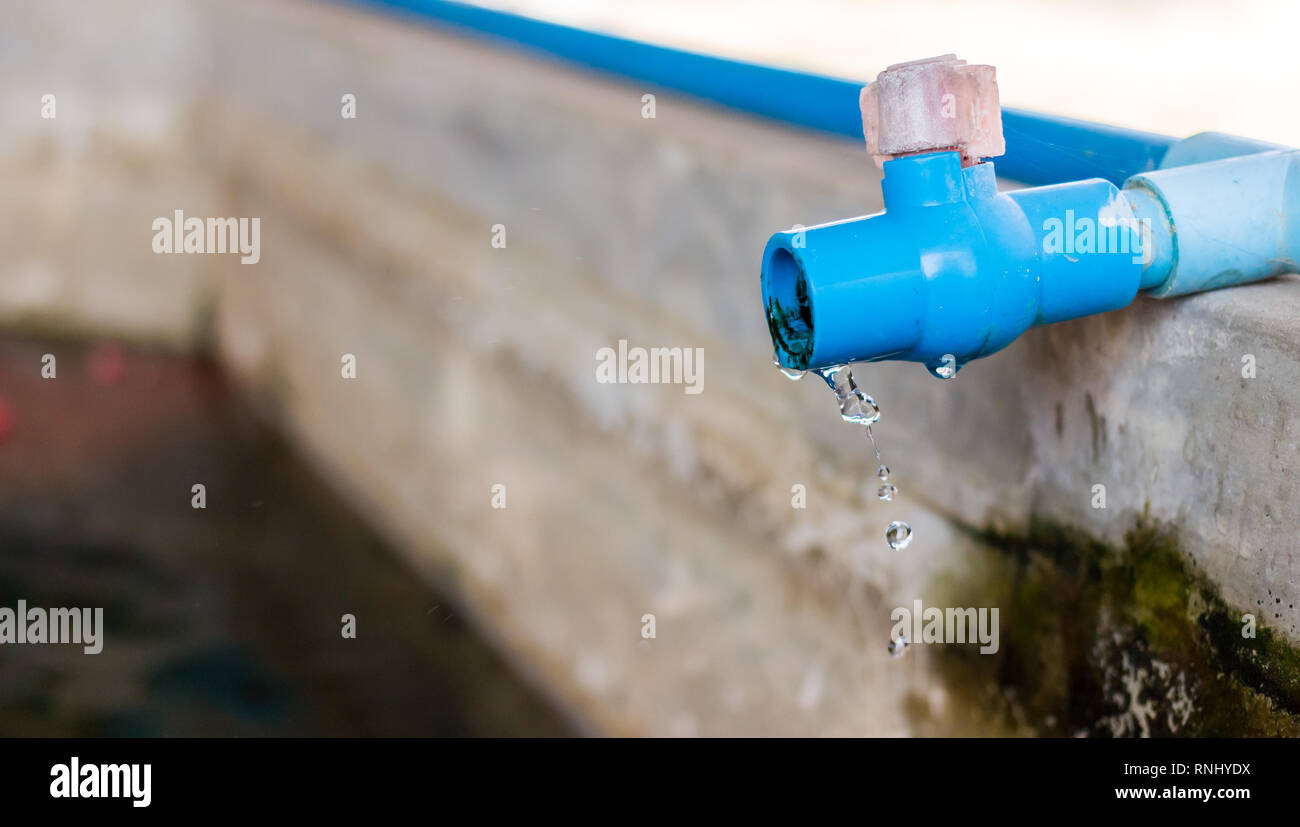 Blue Hose a drop of water Stock Photo - Alamy