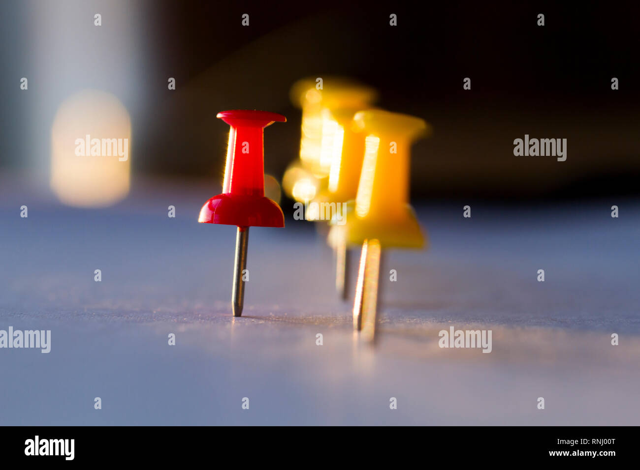 Different red pushpins, highlighted Stock Photo - Alamy