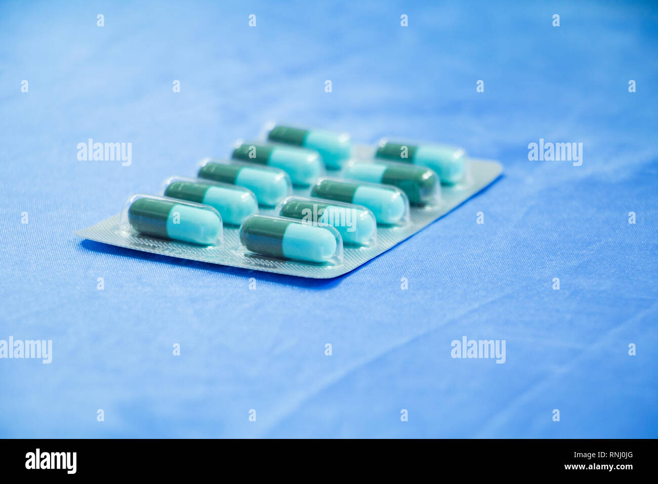 drug capsule green - azure or treatment medication in packages plastic ...