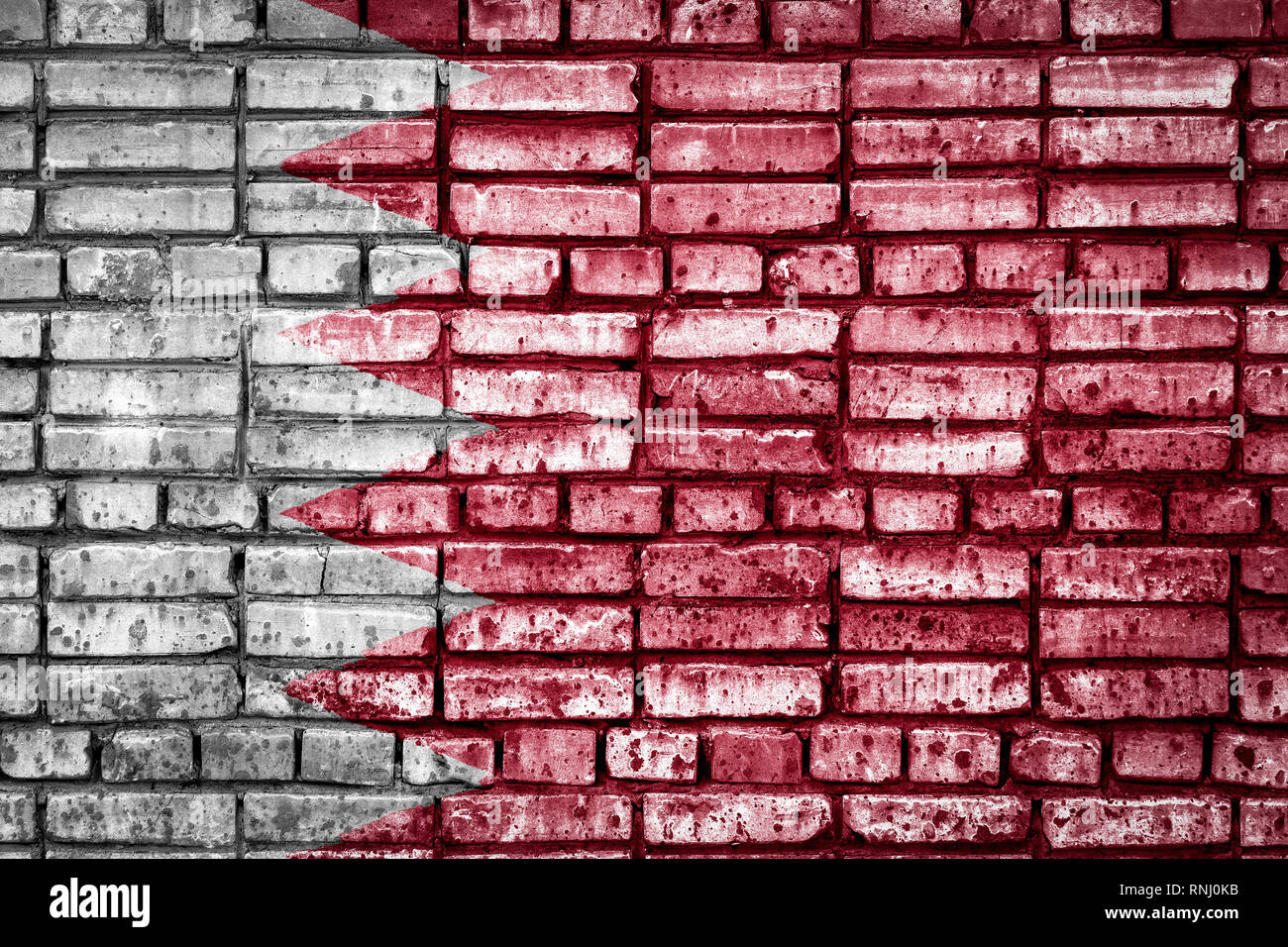 National flag of Bahrain on a brick background. Concept image for ...