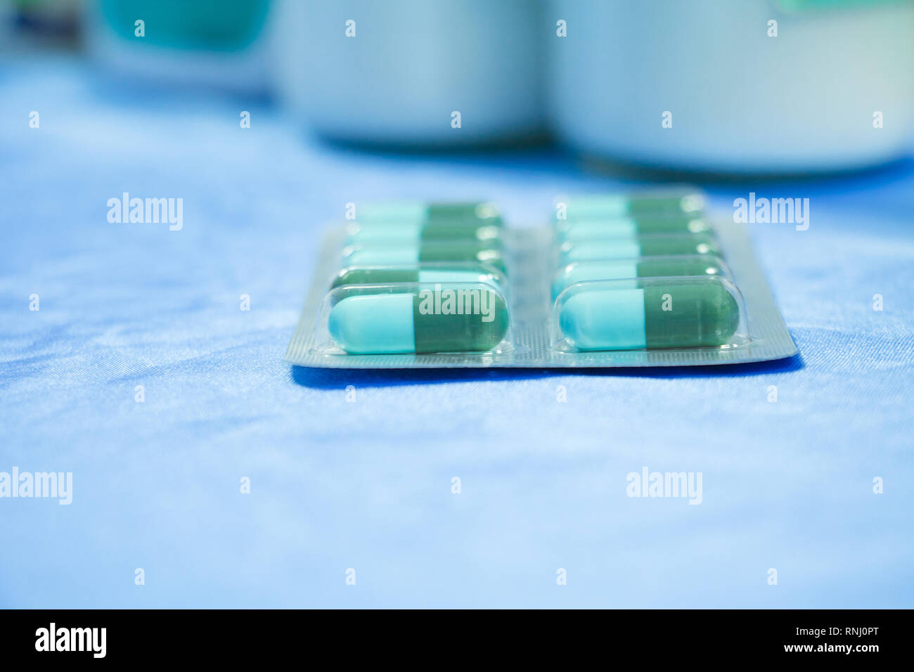 drug capsule green - azure or treatment medication in packages plastic ...