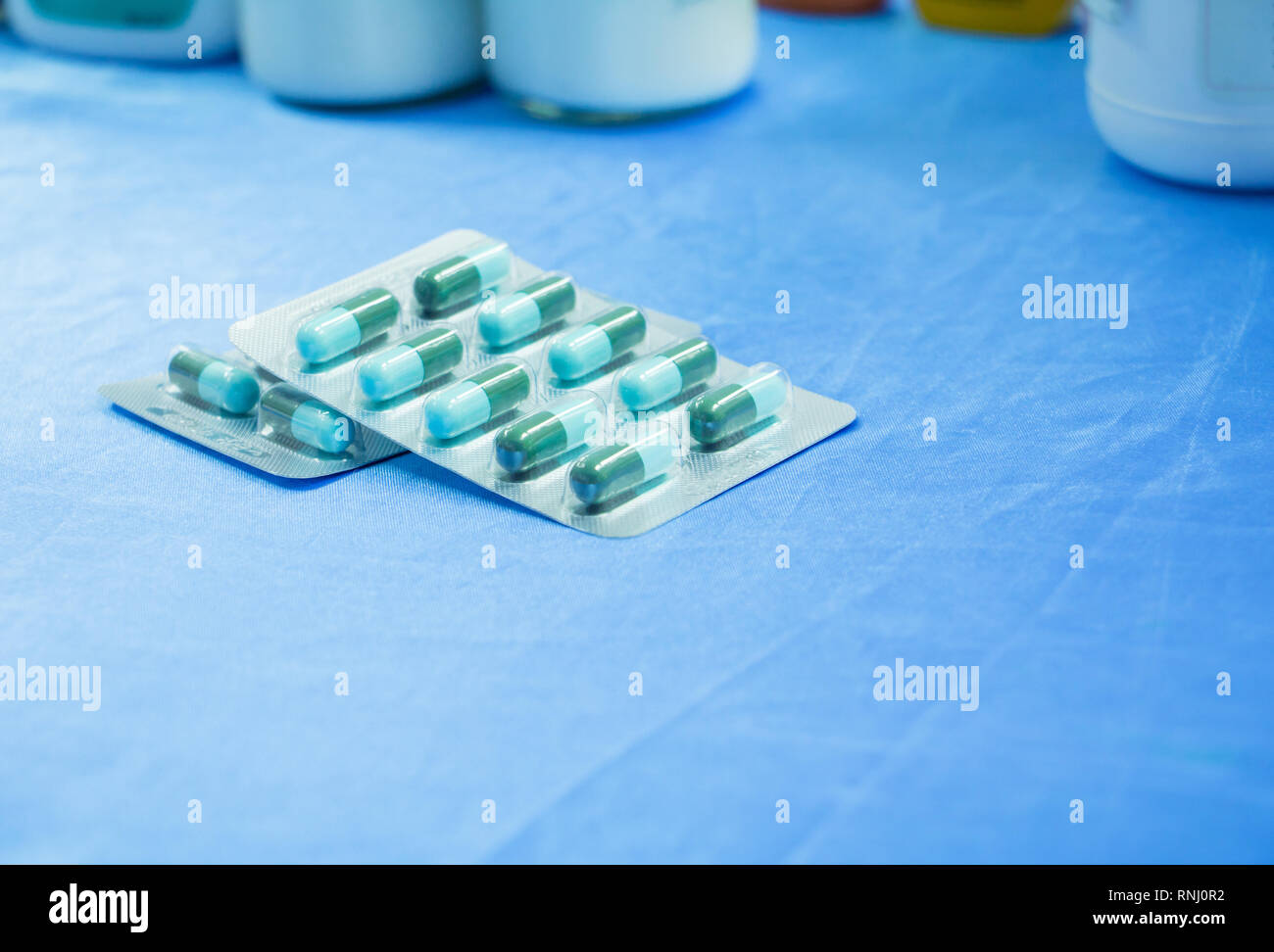 drug capsule green - azure or treatment medication in packages plastic ...