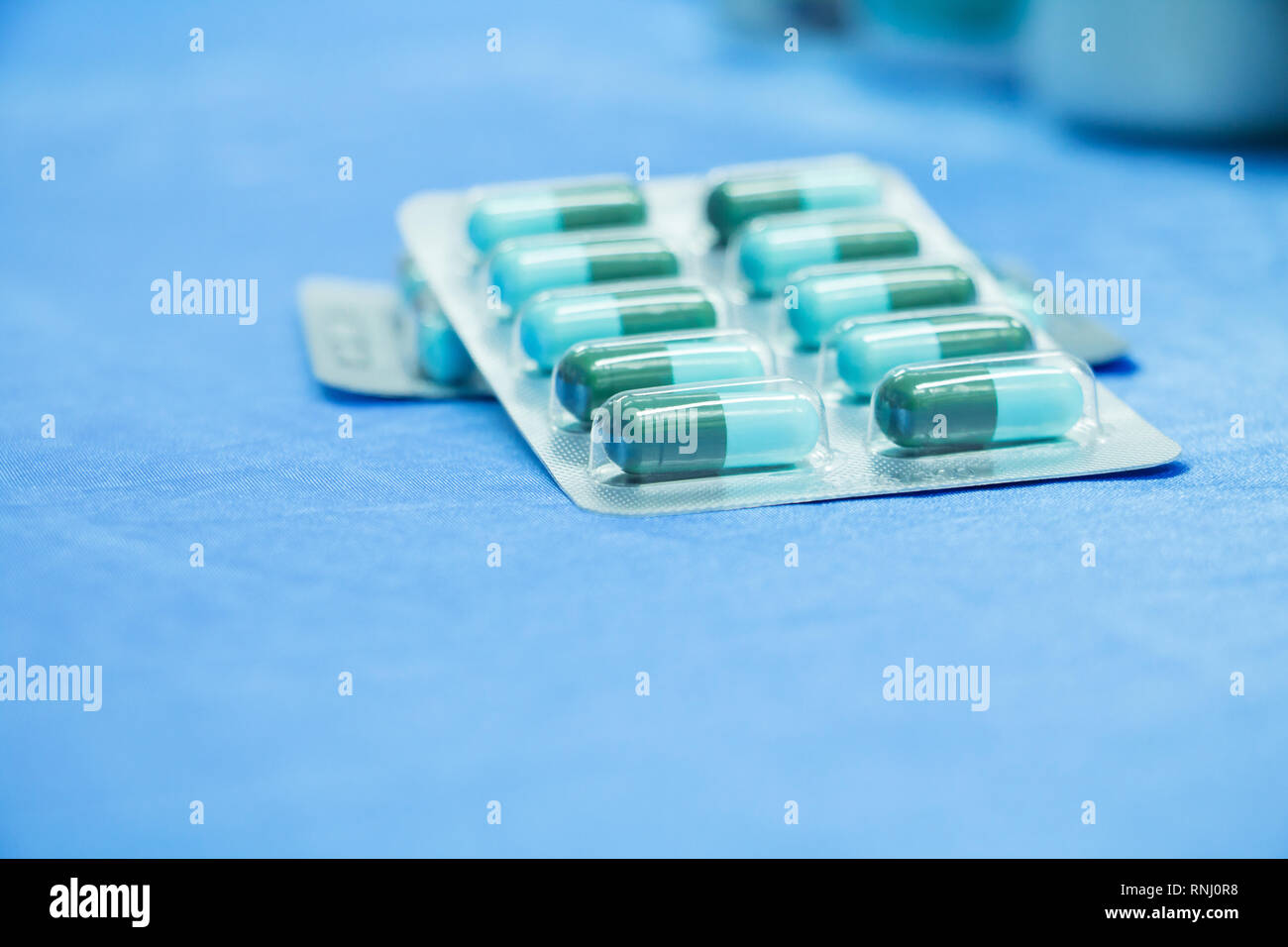 drug capsule green - azure or treatment medication in packages plastic ...