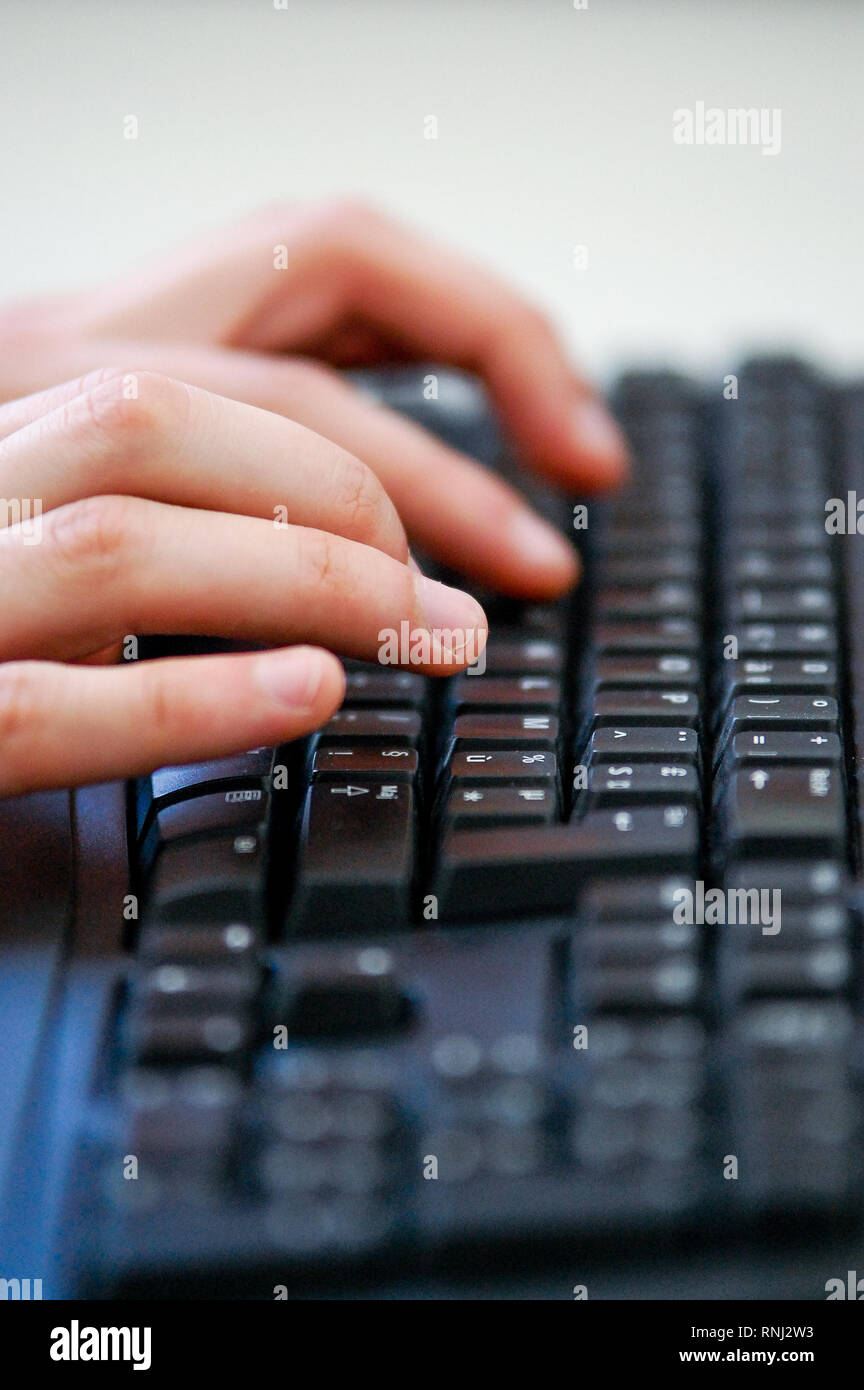 Secretary typing on a computer keyboard, Lyon, France Stock Photo - Alamy