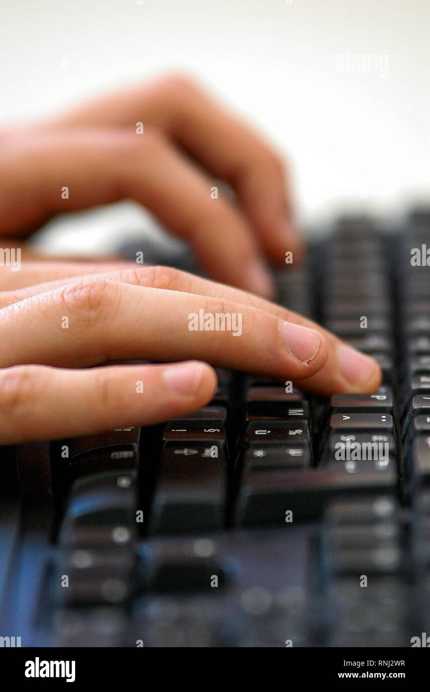 Secretary typing on a computer keyboard, Lyon, France Stock Photo - Alamy