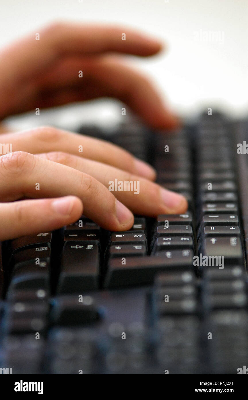 Secretary typing on a computer keyboard, Lyon, France Stock Photo - Alamy