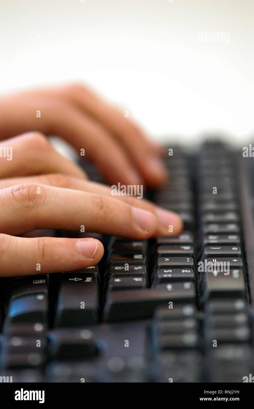 Secretary typing on a computer keyboard, Lyon, France Stock Photo - Alamy